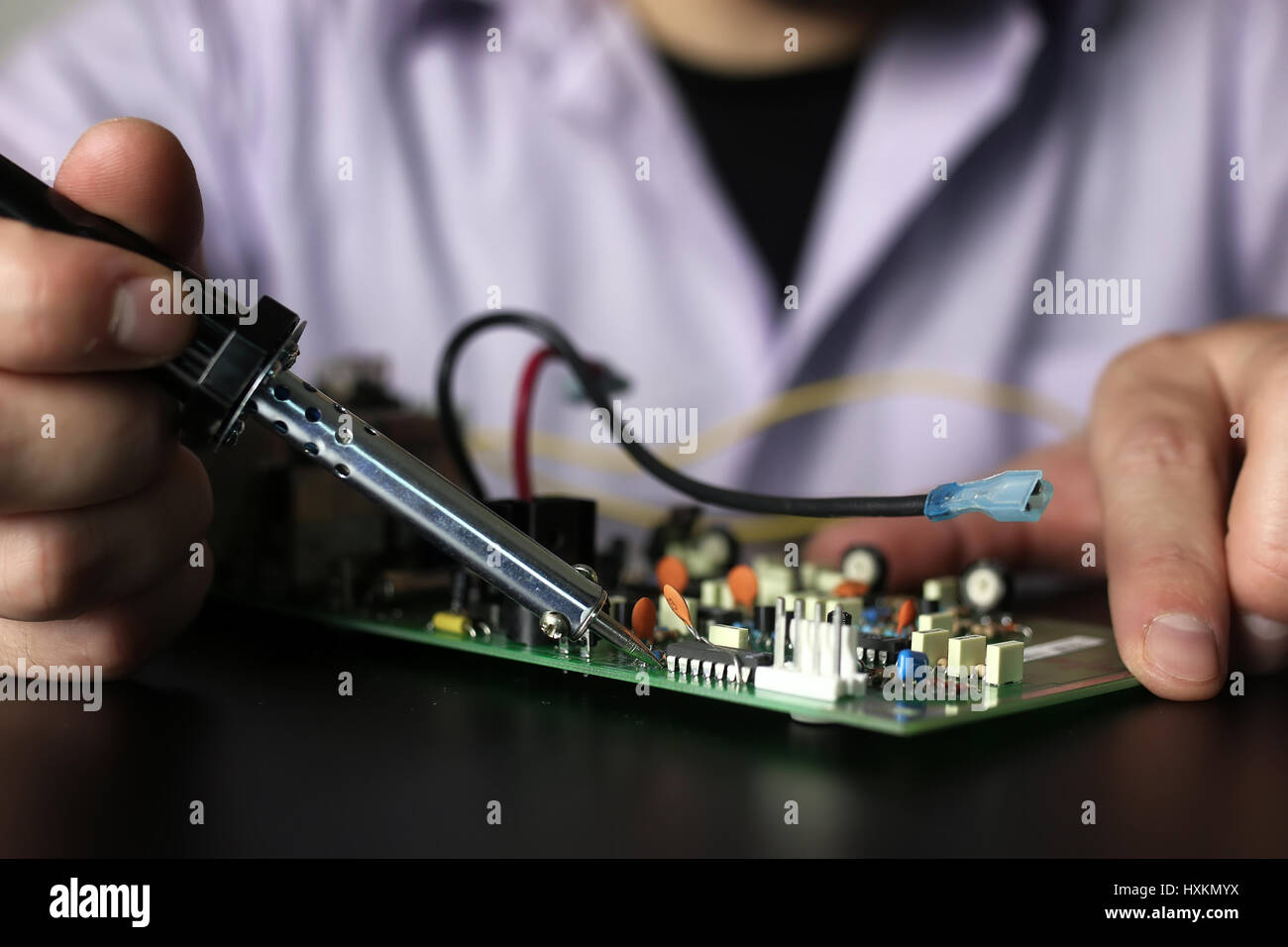 chip soldering man hands Stock Photo - Alamy