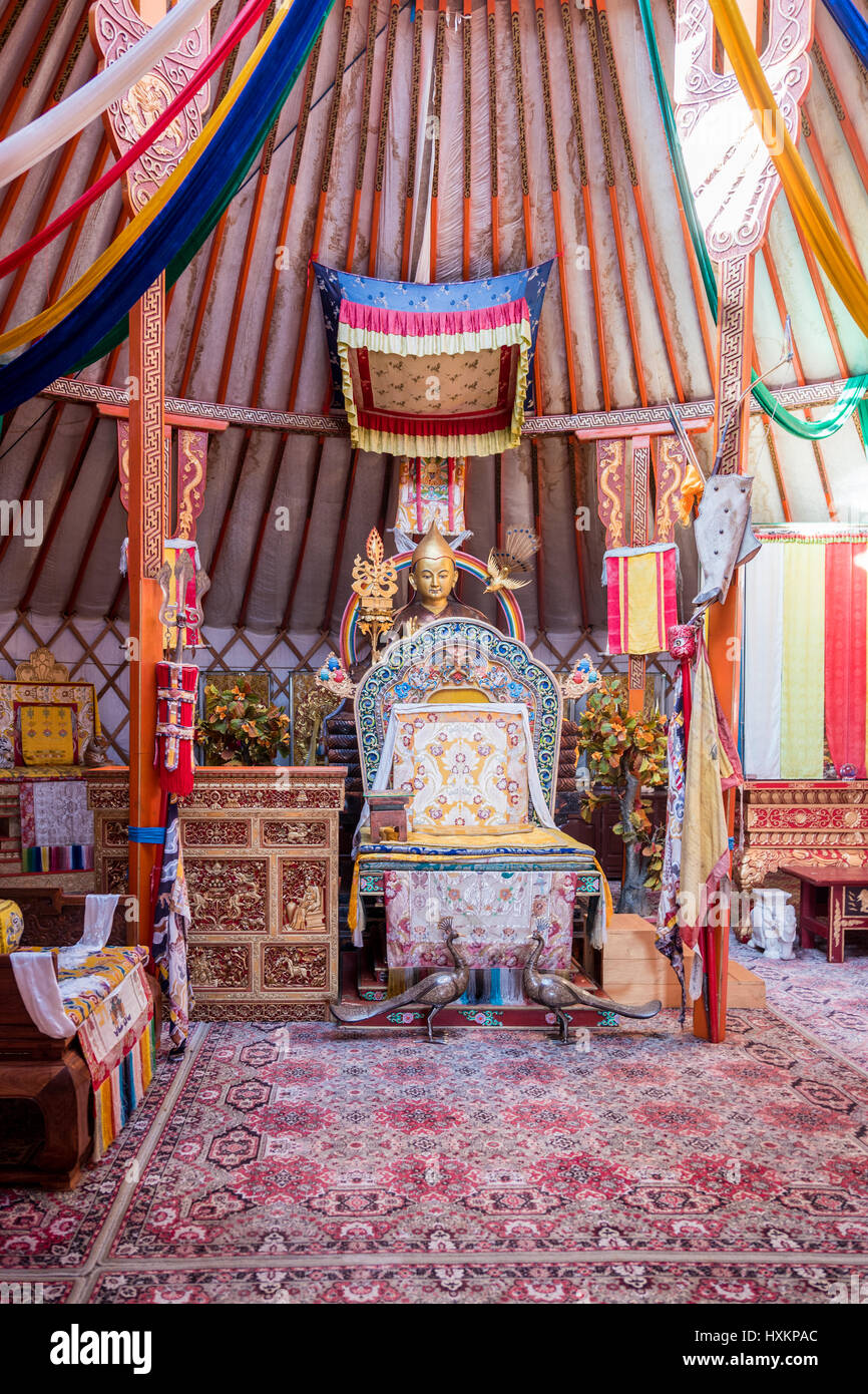 A newly constructed Buddhist Temple stands next to the ger that has ...