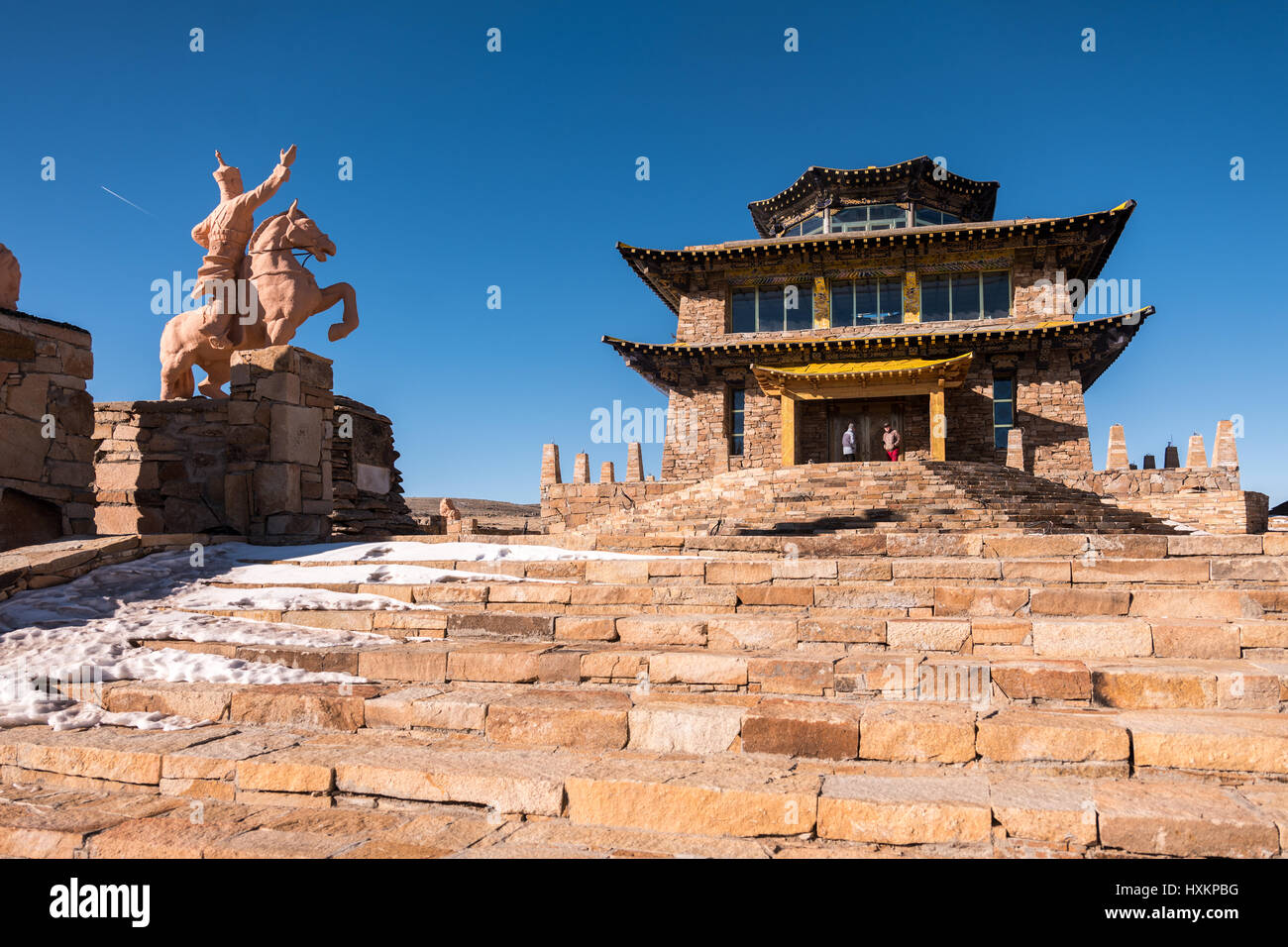 A newly constructed Buddhist Temple stands next to the ger that has ...