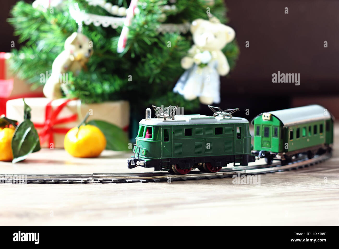 train under tree gift Stock Photo - Alamy