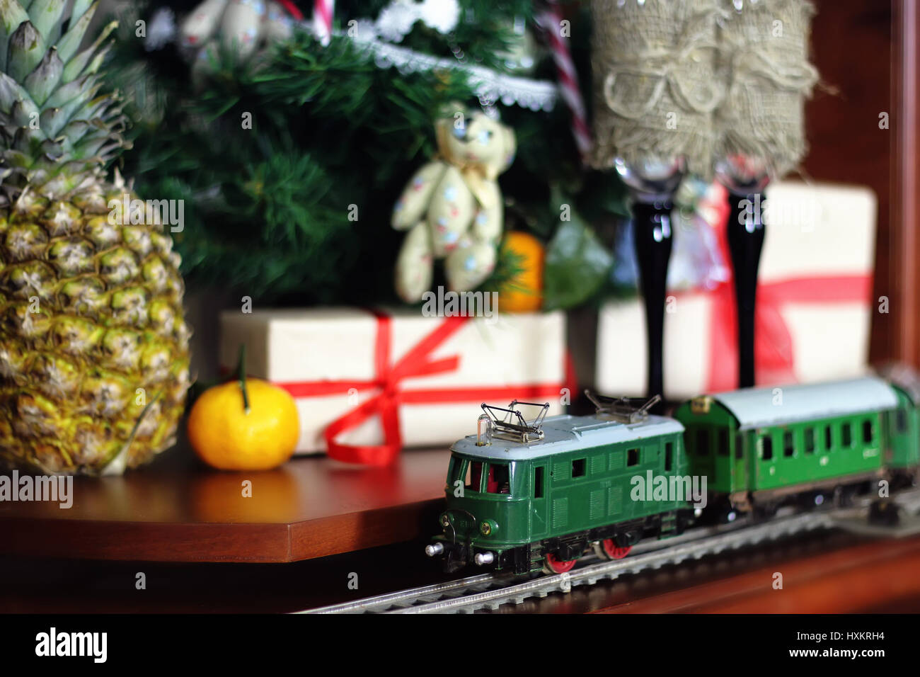 train under tree gift Stock Photo - Alamy