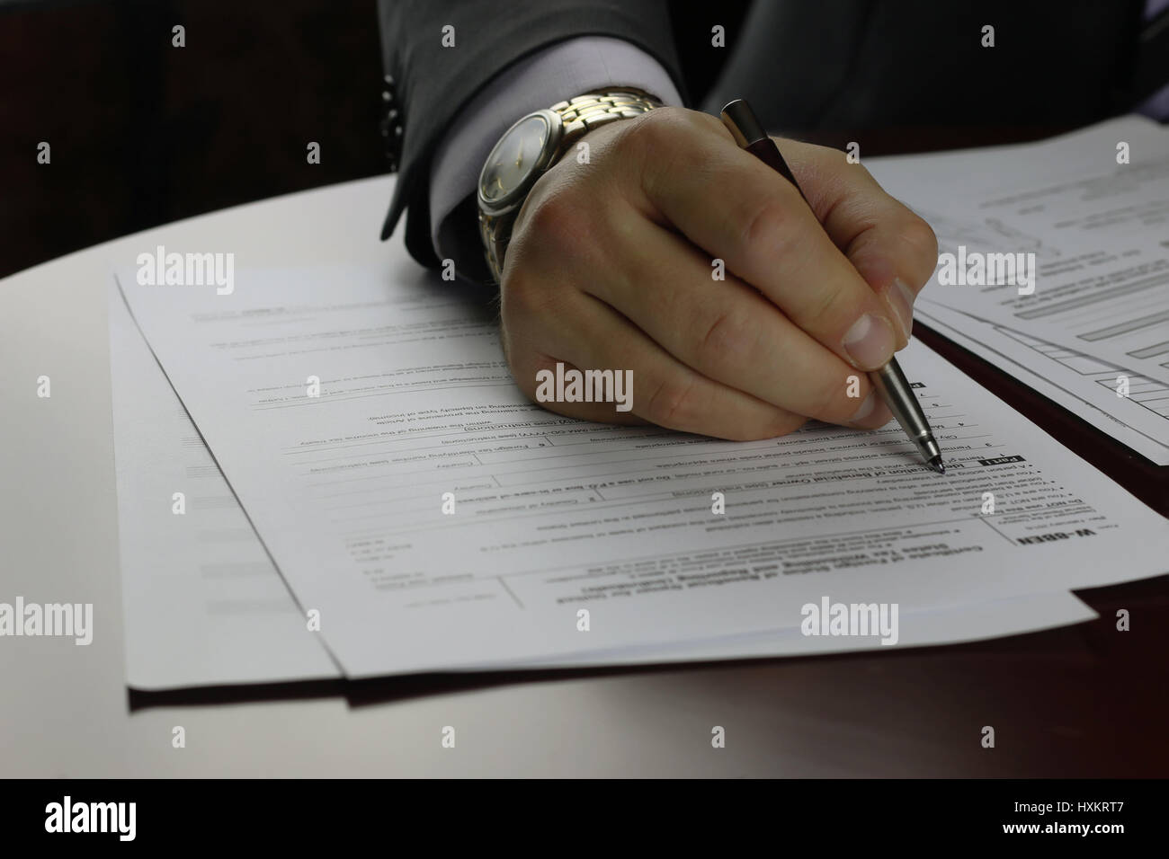 hand signed tax form Stock Photo - Alamy