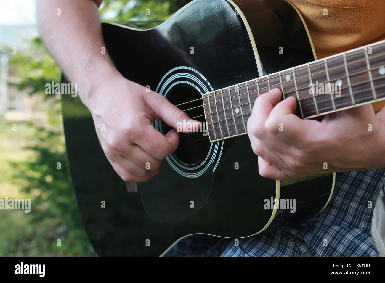 guitar string man hand outdoor Stock Photo - Alamy