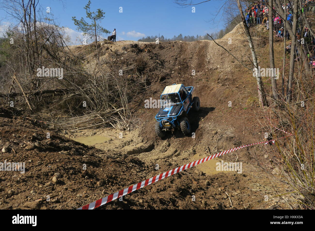 An off-road car is driving downhill at full throttle trying to drive ...