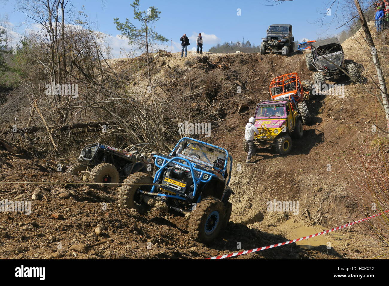 Off-road car got stuck, it'ss pulled uphill fixed with steel wire to ...