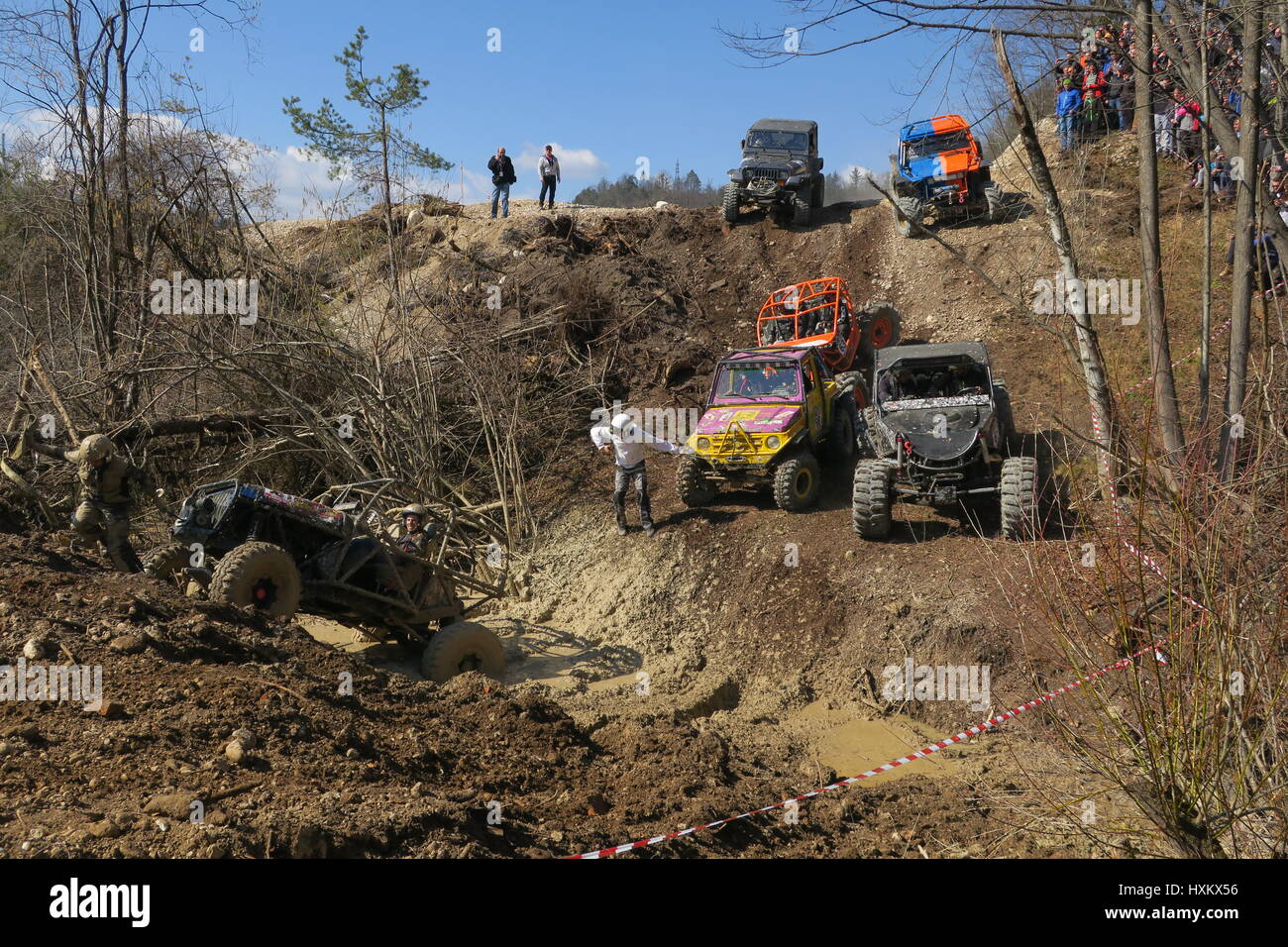 Off-road car got stuck, it'ss pulled uphill fixed with steel wire to ...
