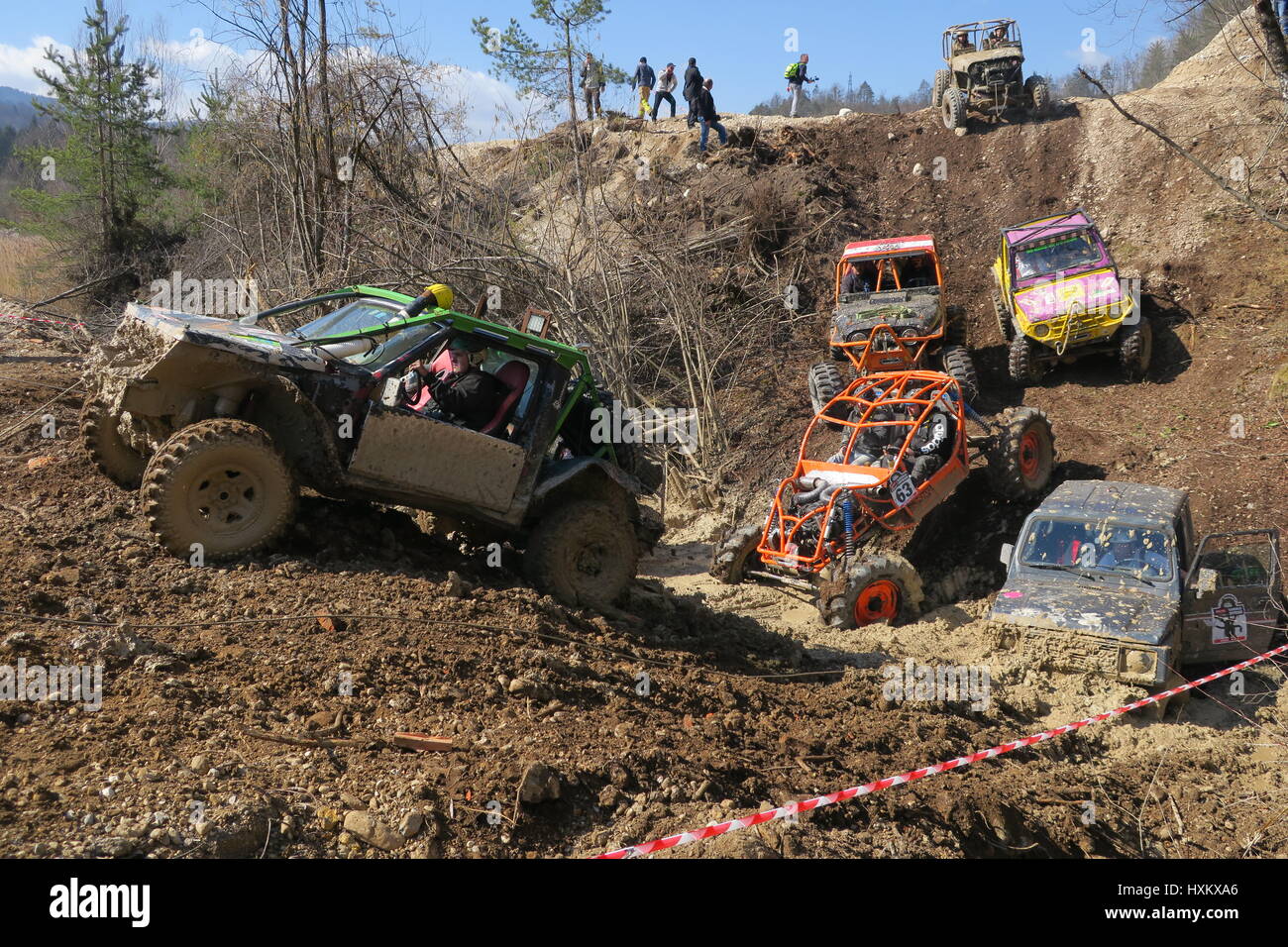 Two off-road cars got stuck in a muddy trench, steel wire at an ...