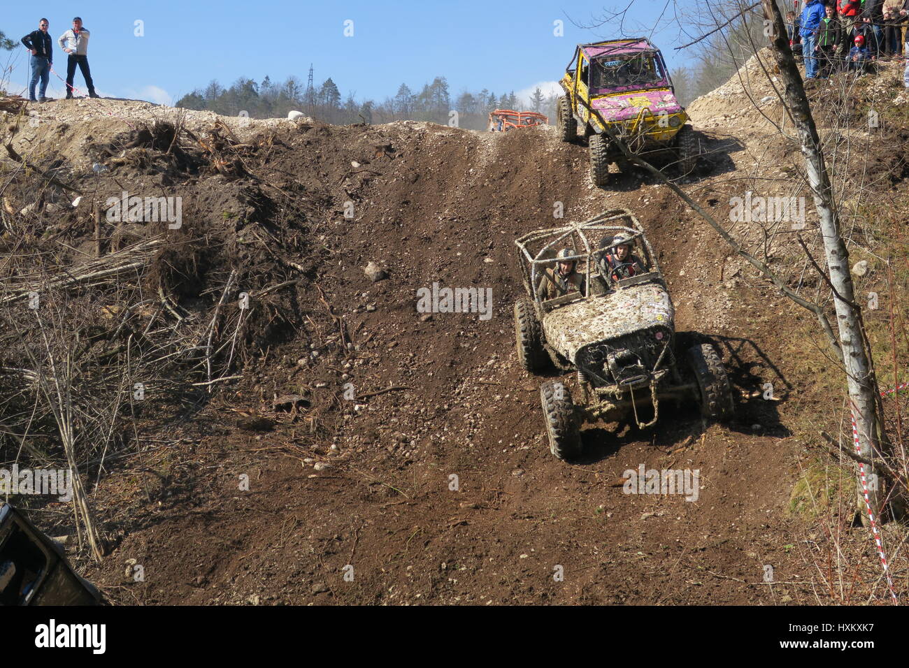 The four-wheel drive and the all-terrain vehicle are driving downhill ...
