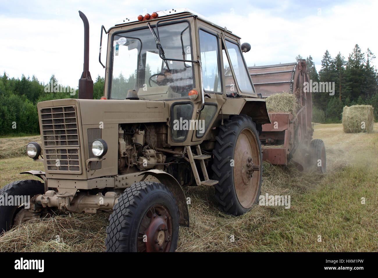 Lemozero, Olonets, Karelia, Russia - July 26, 2006: Farm tractor ...