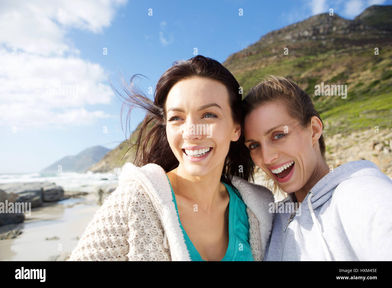 Two smiling women friends taking selfie outside Stock Photo - Alamy