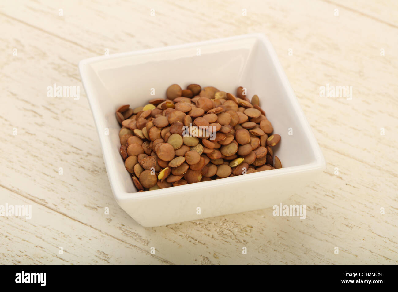 Raw lentils in the bowl ready for cooking Stock Photo - Alamy
