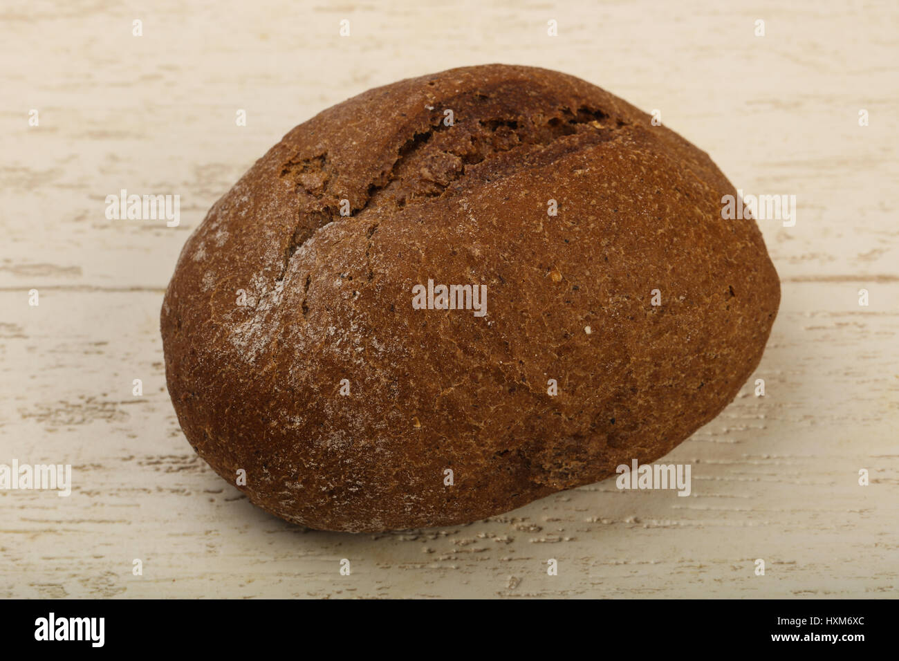 Small bread bun for breakfast over wooden Stock Photo - Alamy