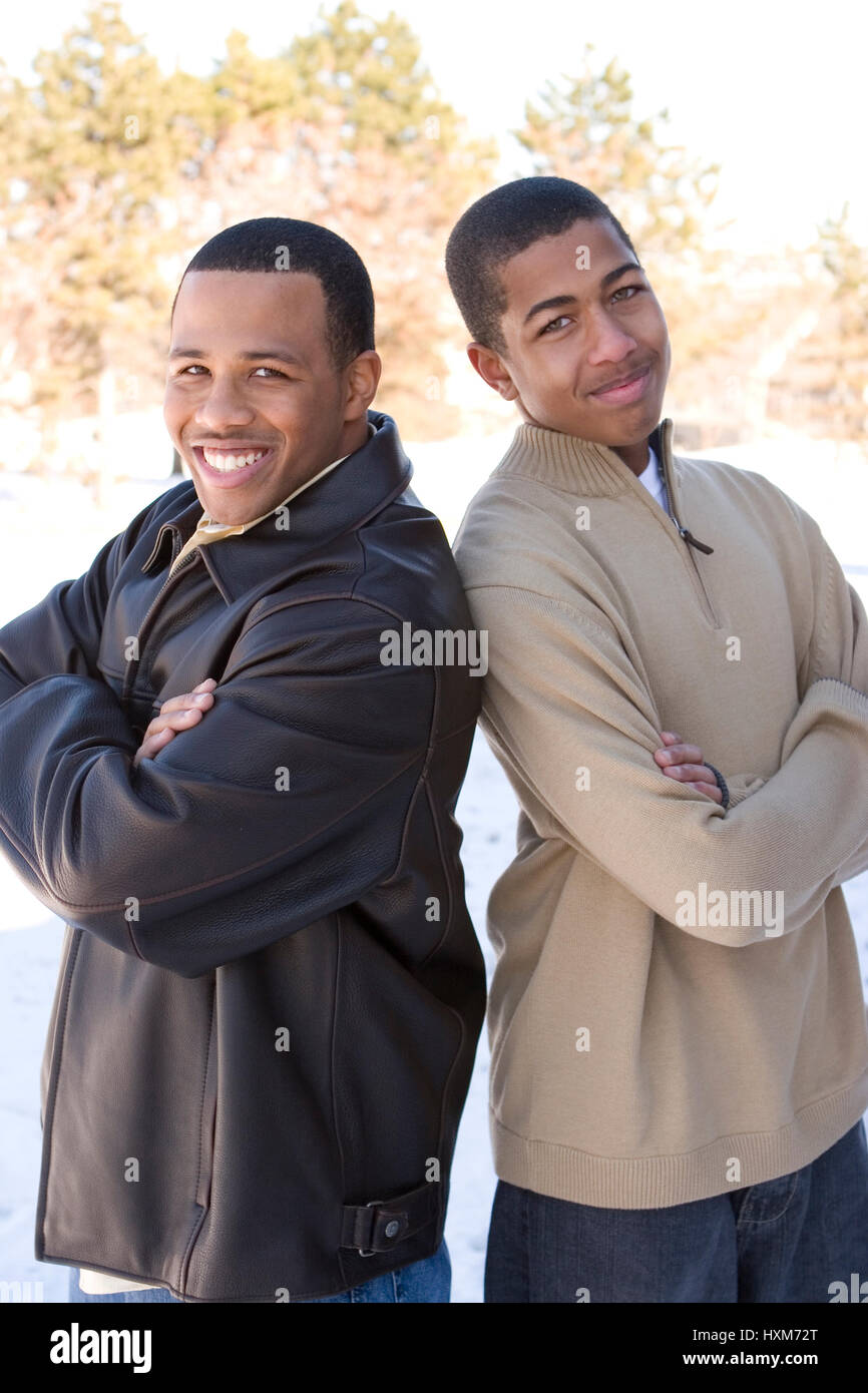 African American teenage brothers smiling and laughing Stock Photo - Alamy