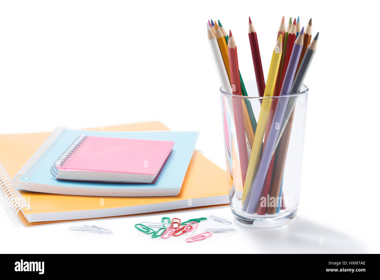 Coloured pencils and note pads Stock Photo - Alamy