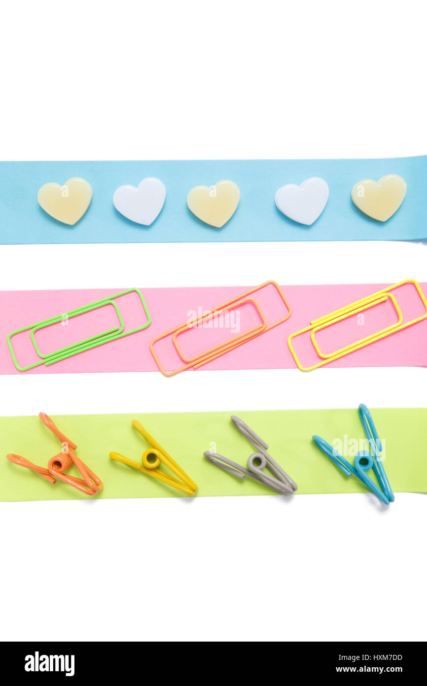 Coloured strips of paper with clips Stock Photo - Alamy