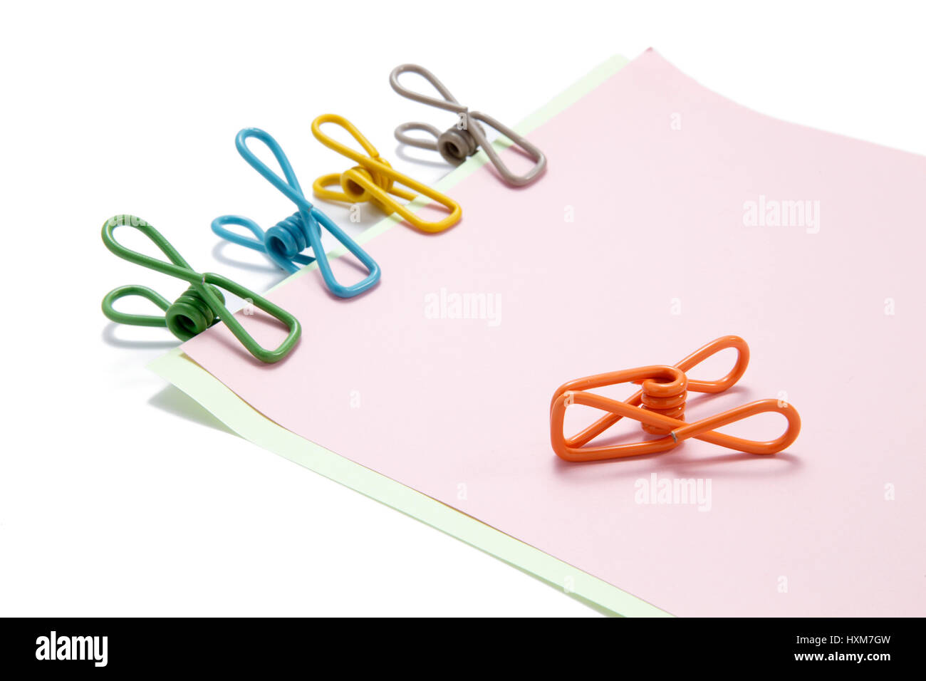 Binder clips with coloured paper Stock Photo - Alamy