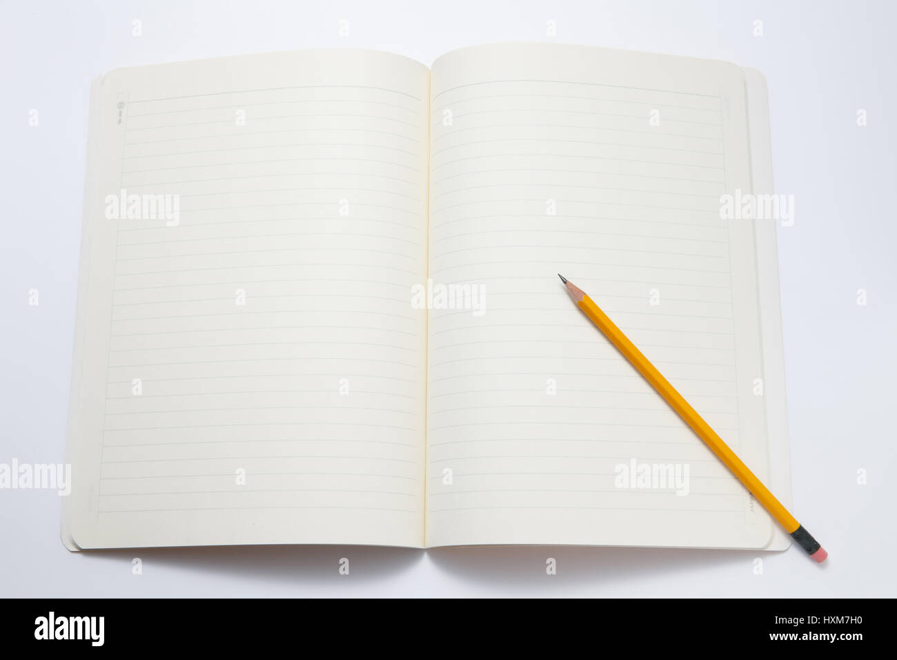 Note pad with pencil Stock Photo - Alamy