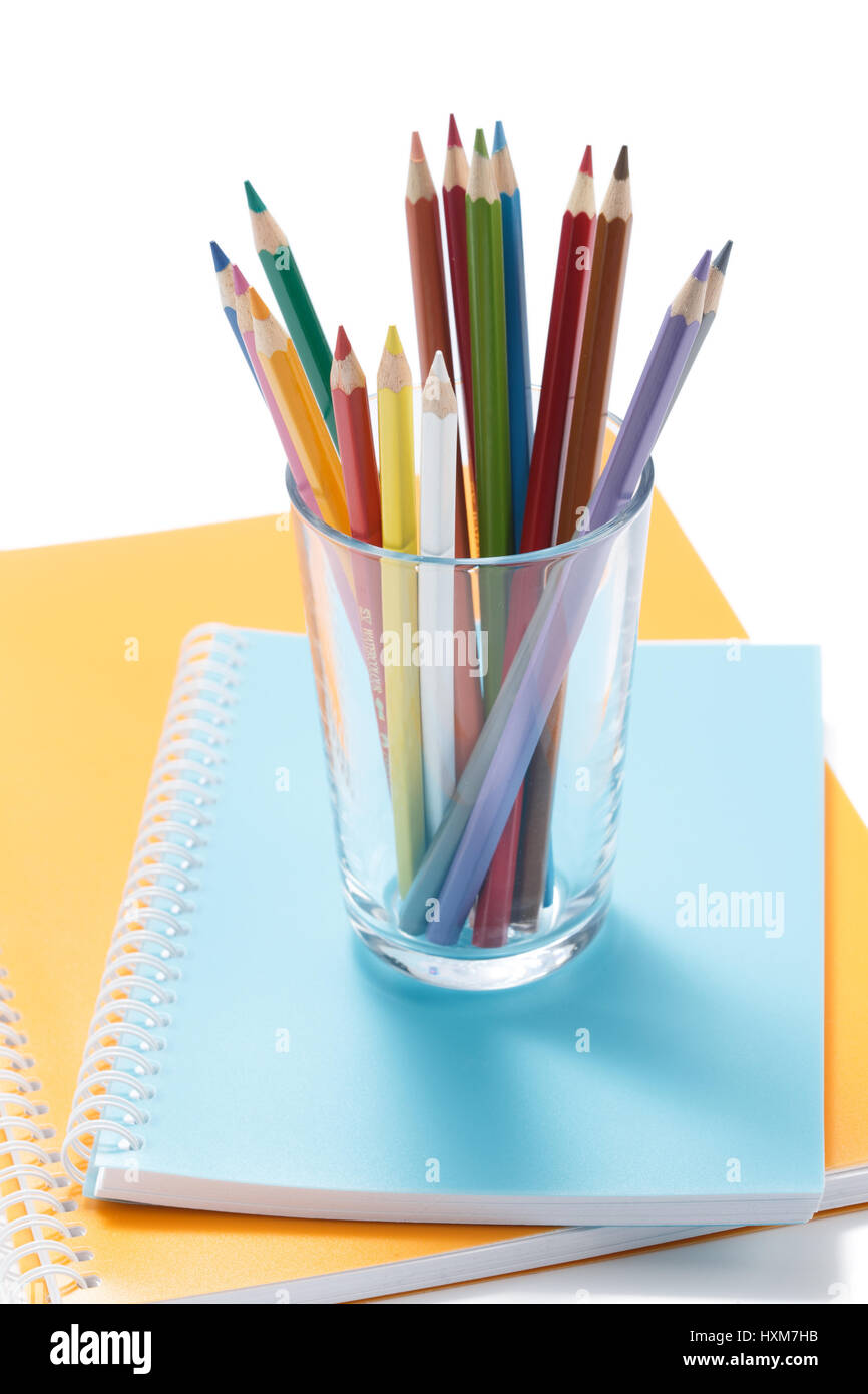 Coloured pencils and note pads Stock Photo - Alamy