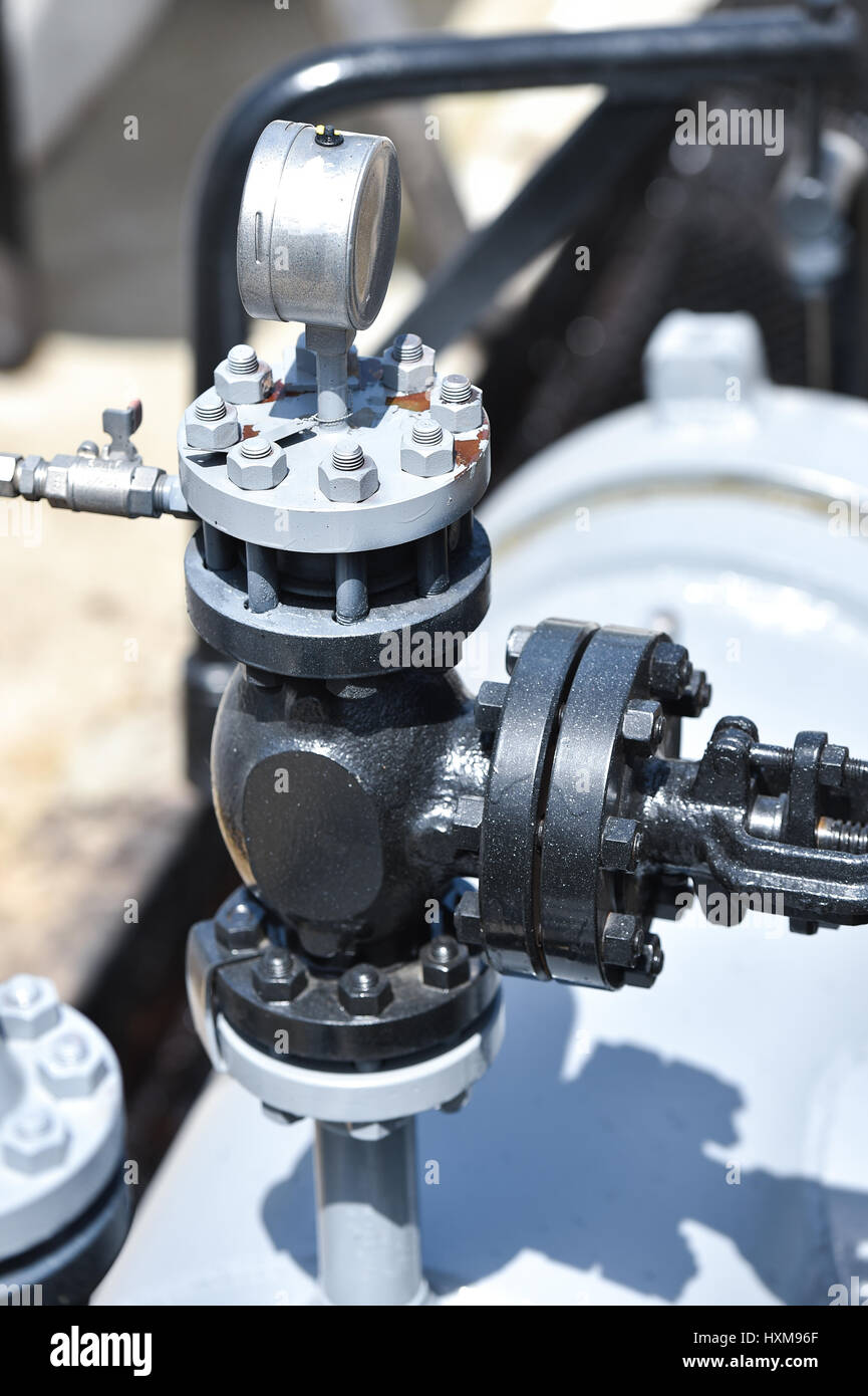 Industrial detail shot with oil pipelines and valves Stock Photo - Alamy
