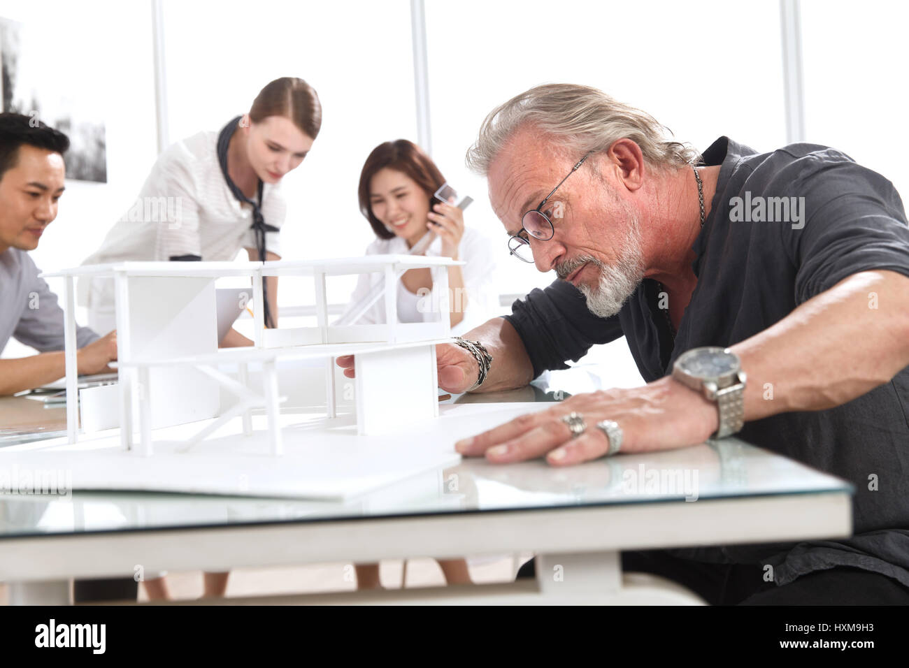 Architects working in office Stock Photo - Alamy