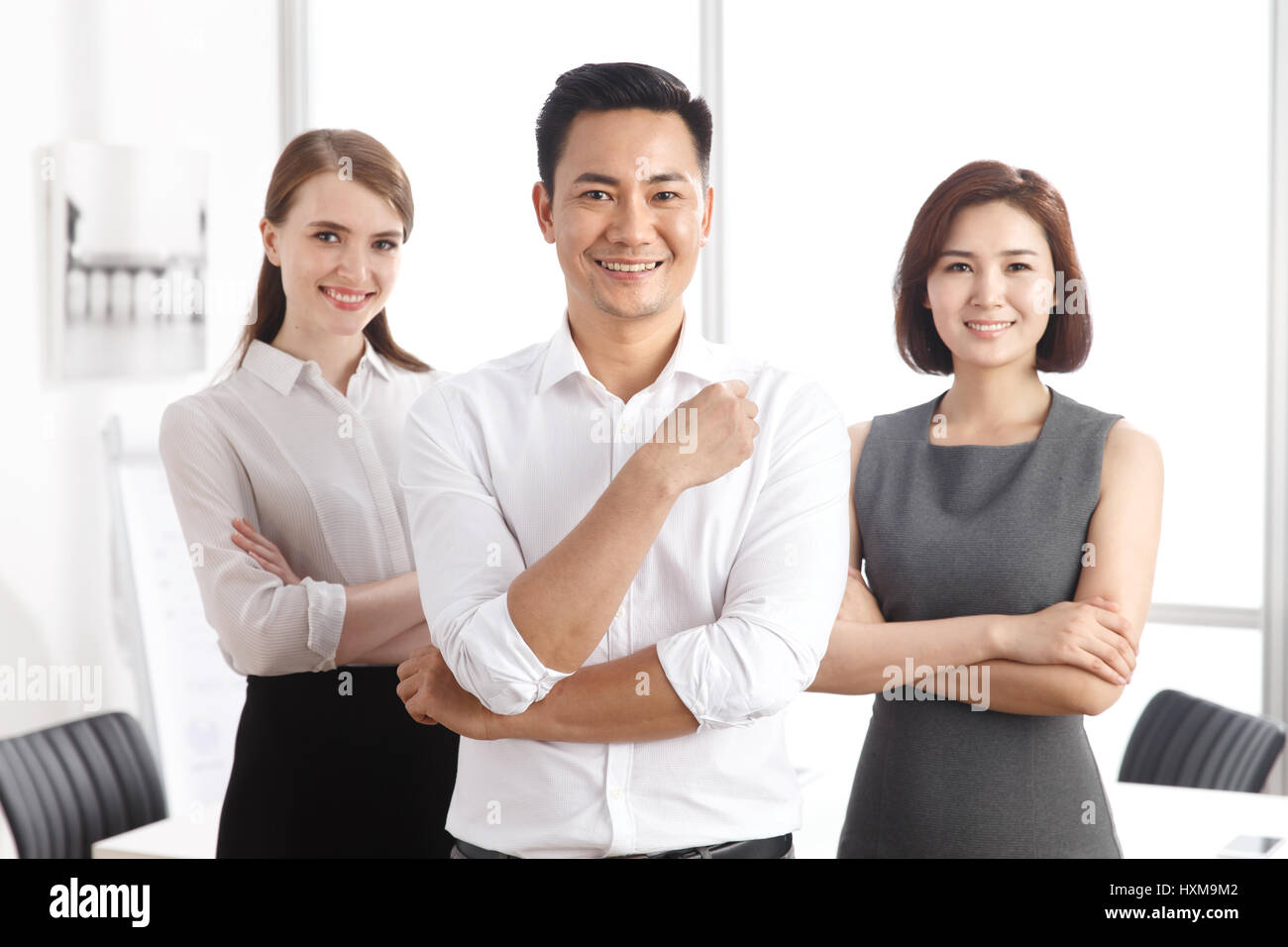 Portrait of three business people Stock Photo - Alamy