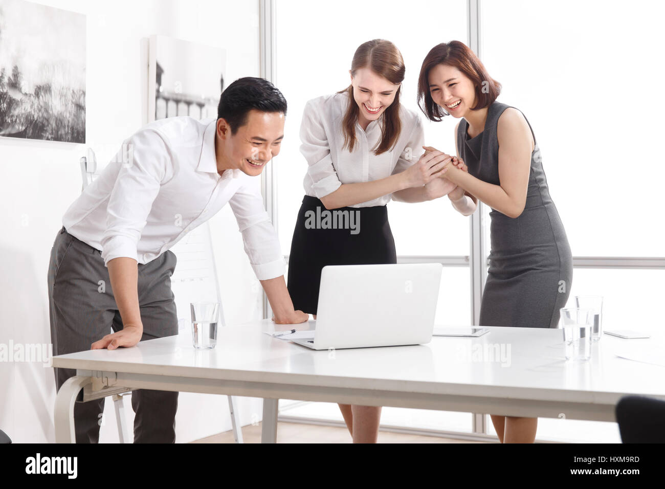 Three business people in office Stock Photo - Alamy