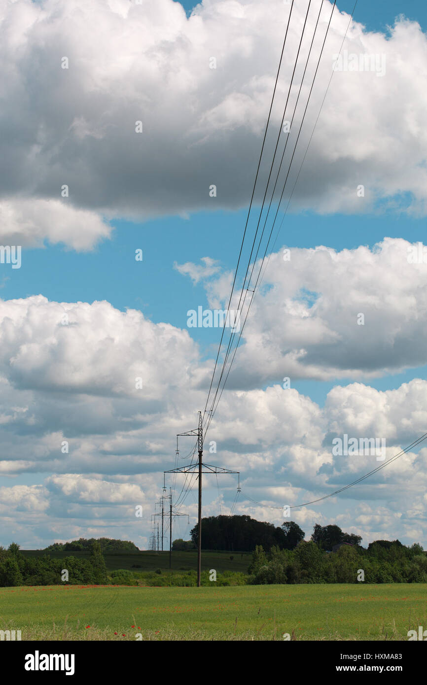 Electricity line in the green landscape Stock Photo - Alamy