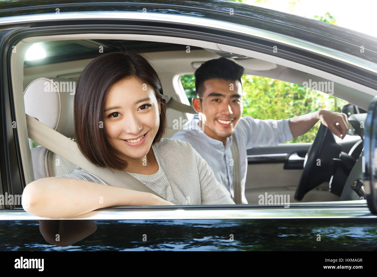 Young couple driving on trip Stock Photo - Alamy