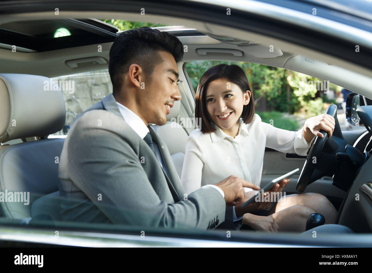 Business people in car Stock Photo - Alamy