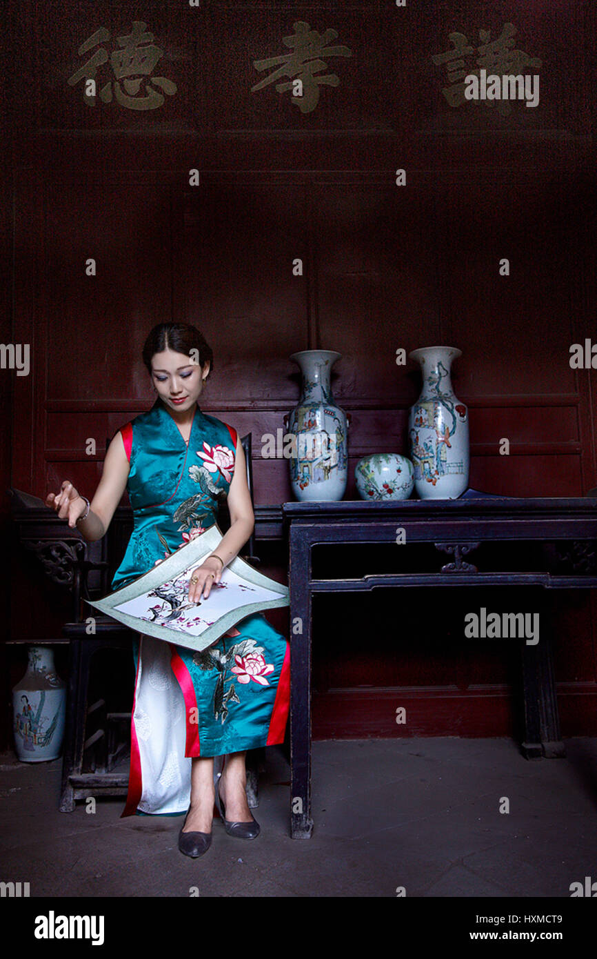 Young women are doing embroidery Stock Photo - Alamy
