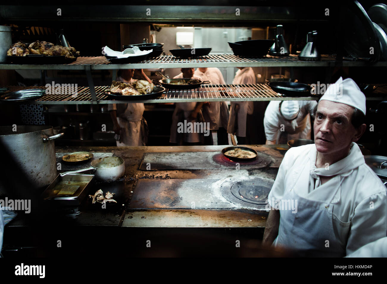 A Spanish chef at work in a kitchen in Barcelona, Spain Stock Photo - Alamy