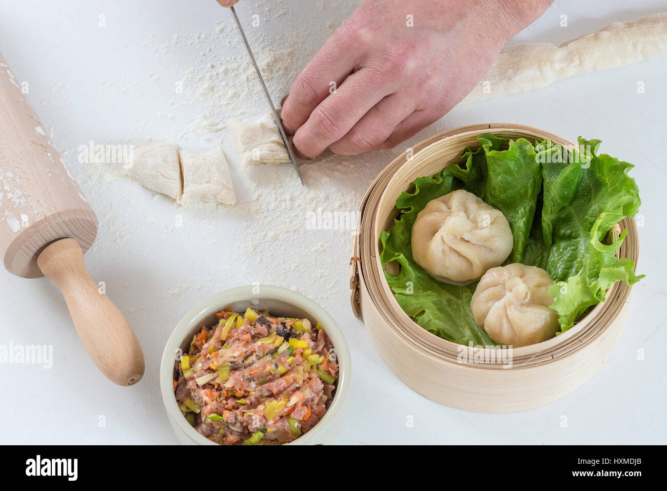 Hands preparing homemade dim-sum asian dumplings buns Stock Photo - Alamy