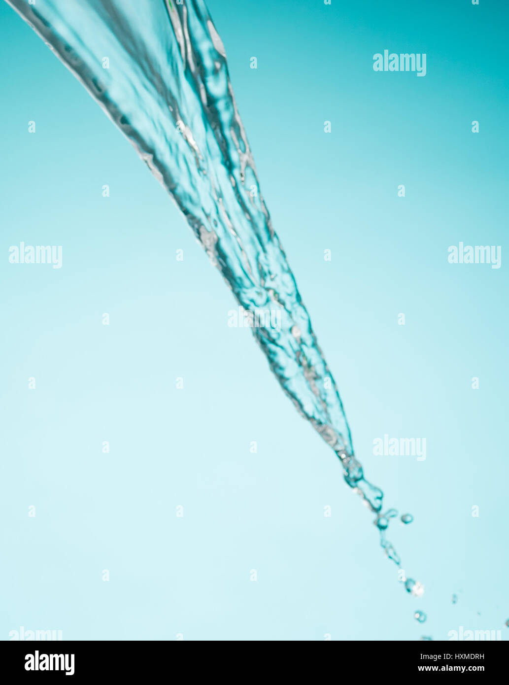 The water splashing to glass bowl on white background Stock Photo - Alamy