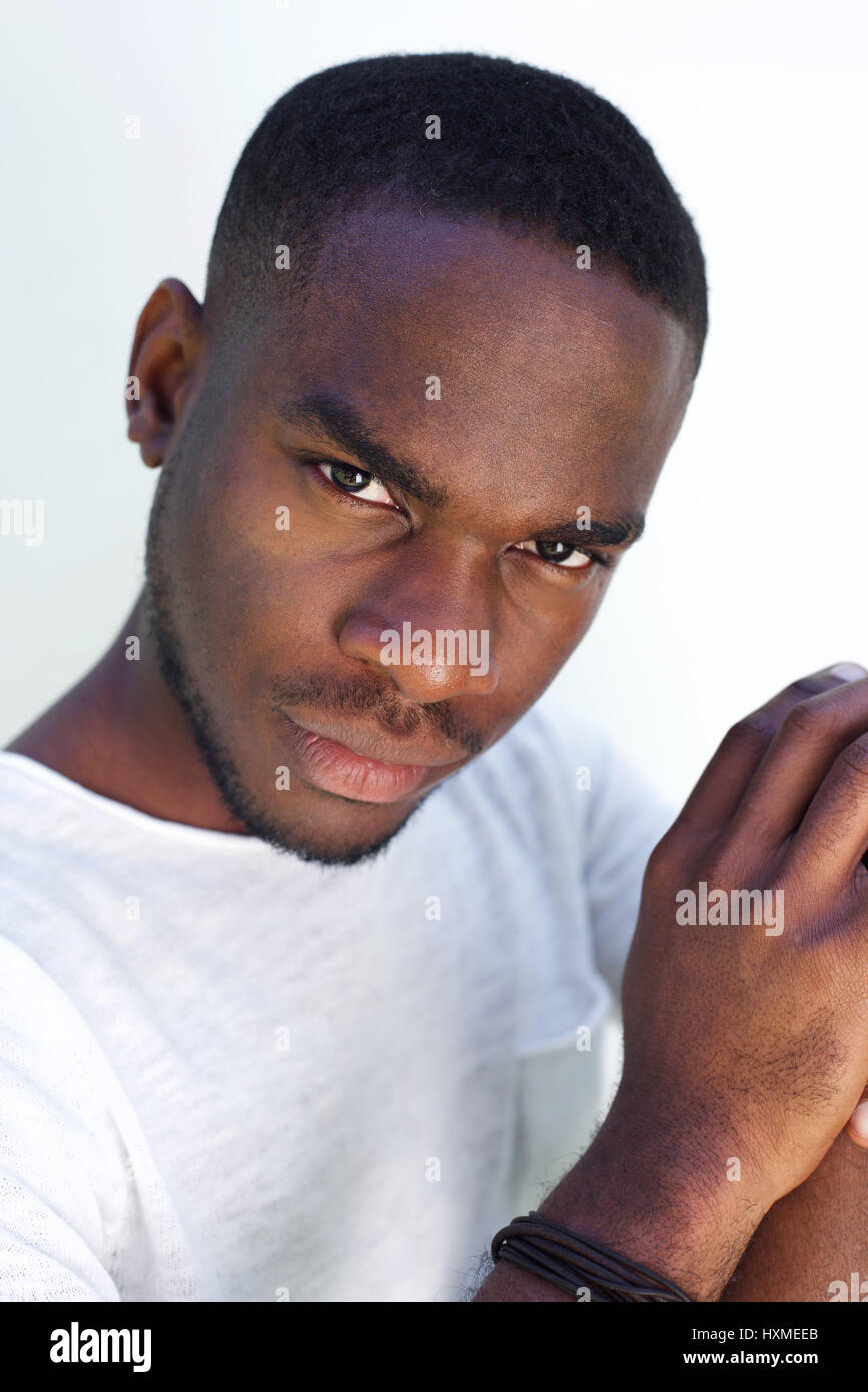 Close up portrait of serious looking young african man Stock Photo - Alamy