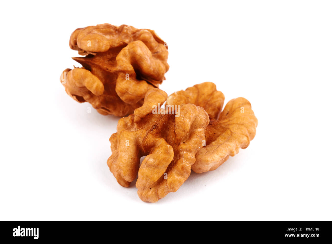 Group of peeled walnuts isolated on a white Stock Photo - Alamy