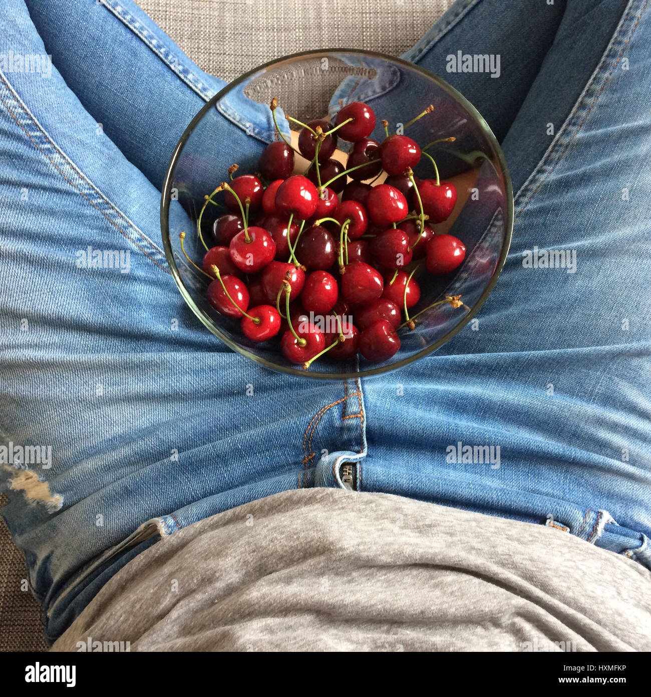 Female eating cherries hi-res stock photography and images - Alamy
