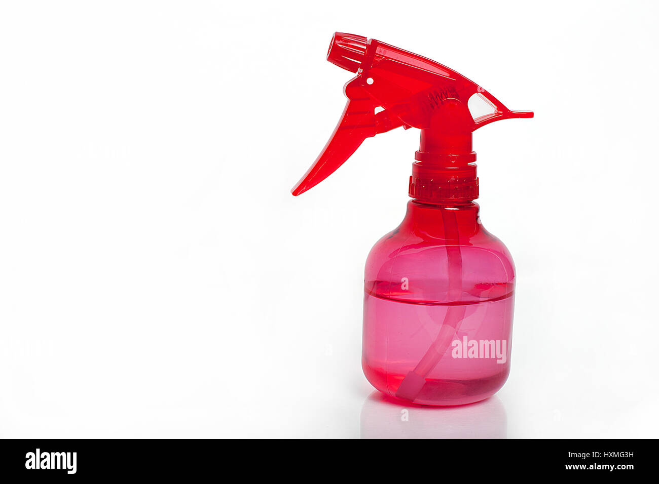 Red spray bottle isolated on white background Stock Photo - Alamy