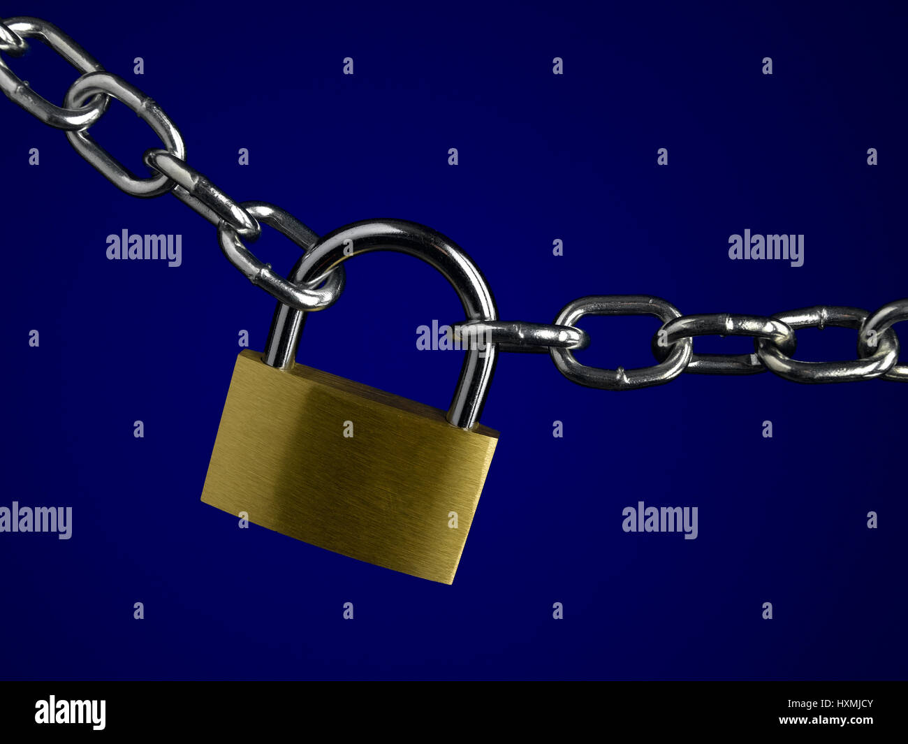 Padlock and chain on blue Stock Photo - Alamy