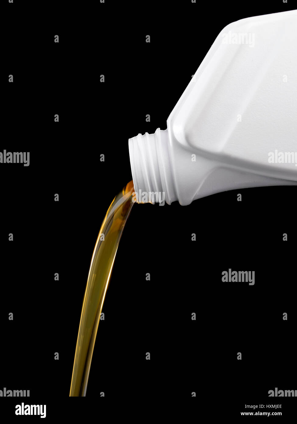 Oil can pouring Stock Photo - Alamy