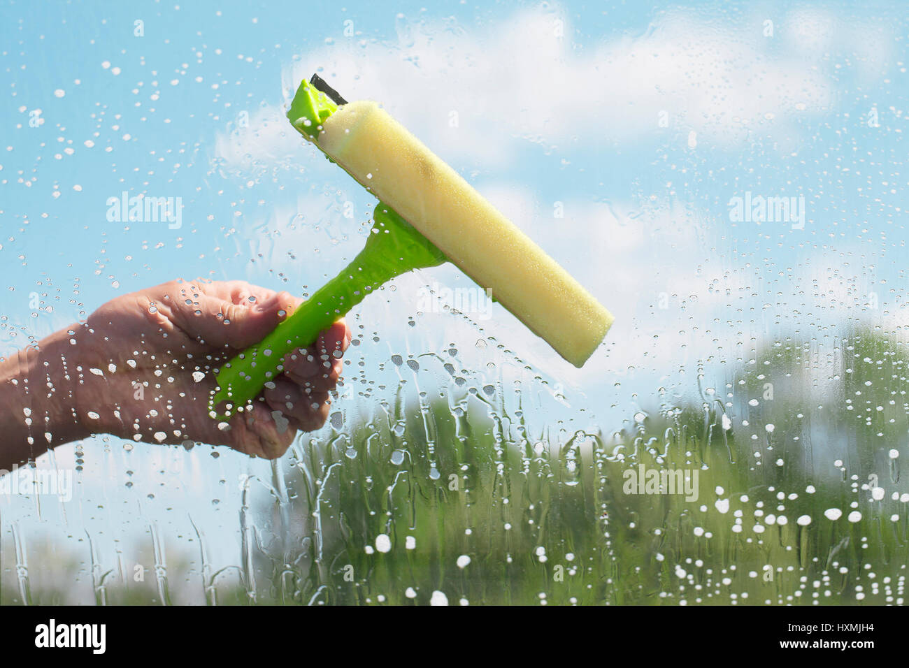 Human hand cleaning window Stock Photo - Alamy