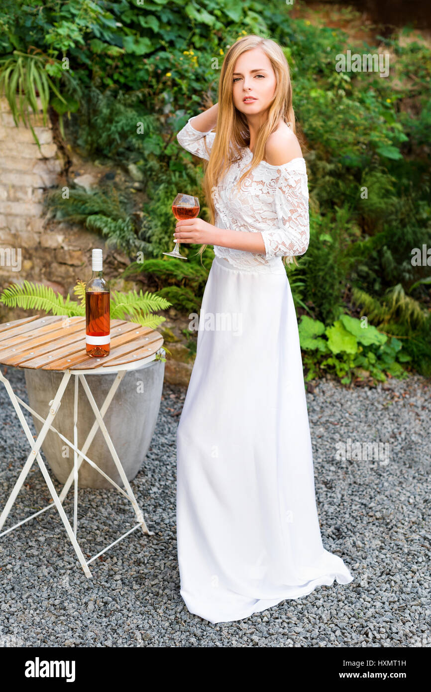 Beautiful woman drinking wine in outdoors cafe. Portrait of young ...