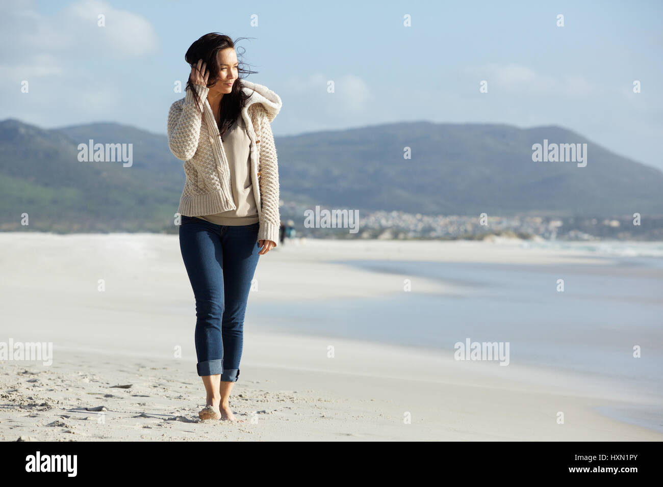 Lady walking into the sea hi-res stock photography and images - Alamy
