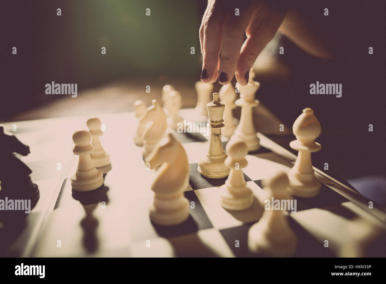 Image of the white pieces on a chess board, with shallow depth of field ...