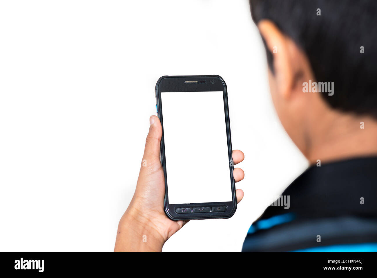 an handsome kid addicted to his cell phone Stock Photo - Alamy