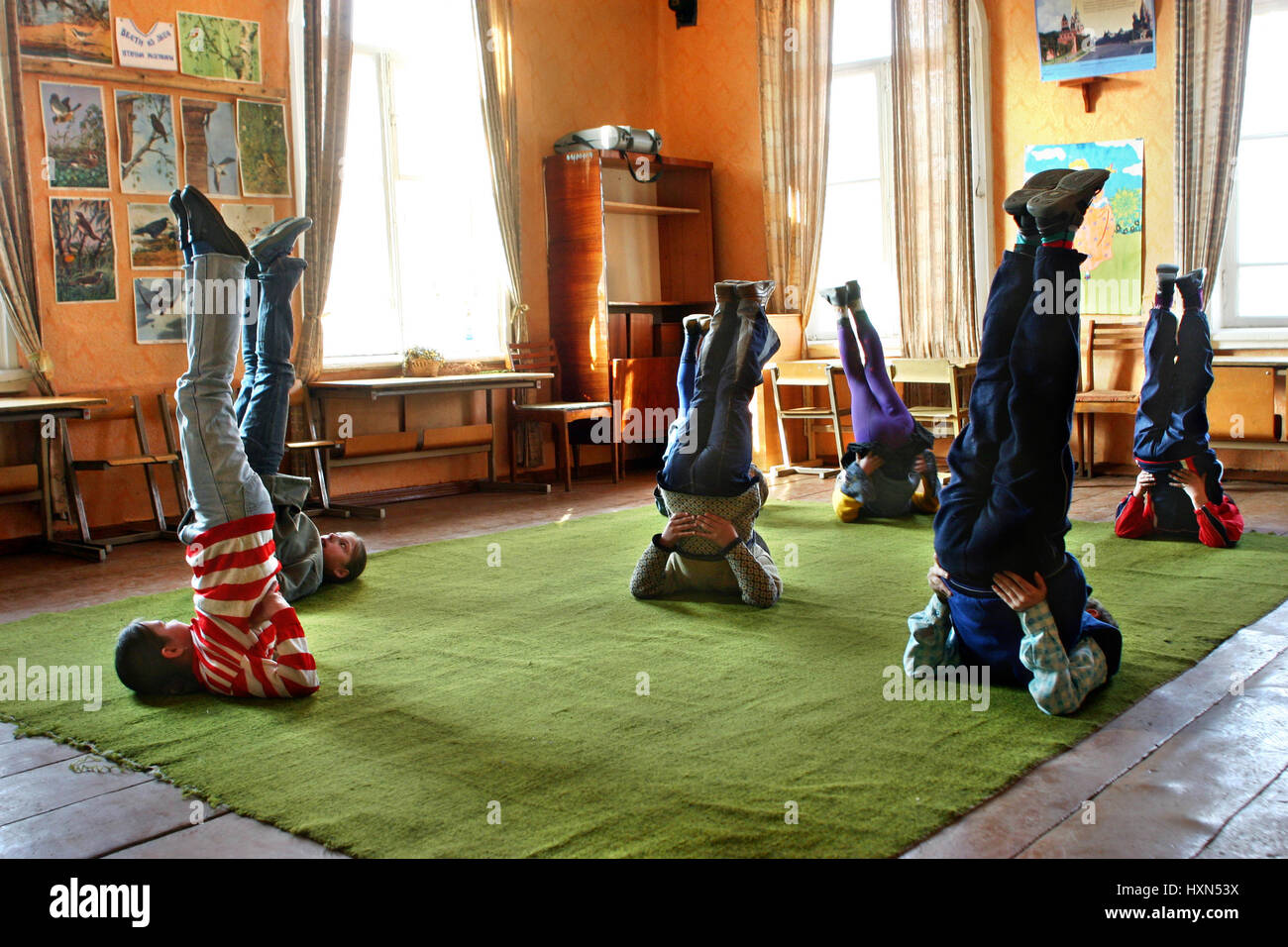 Tver, Russia - May 2, 2006: physical education classes rural school children doing exercise ...