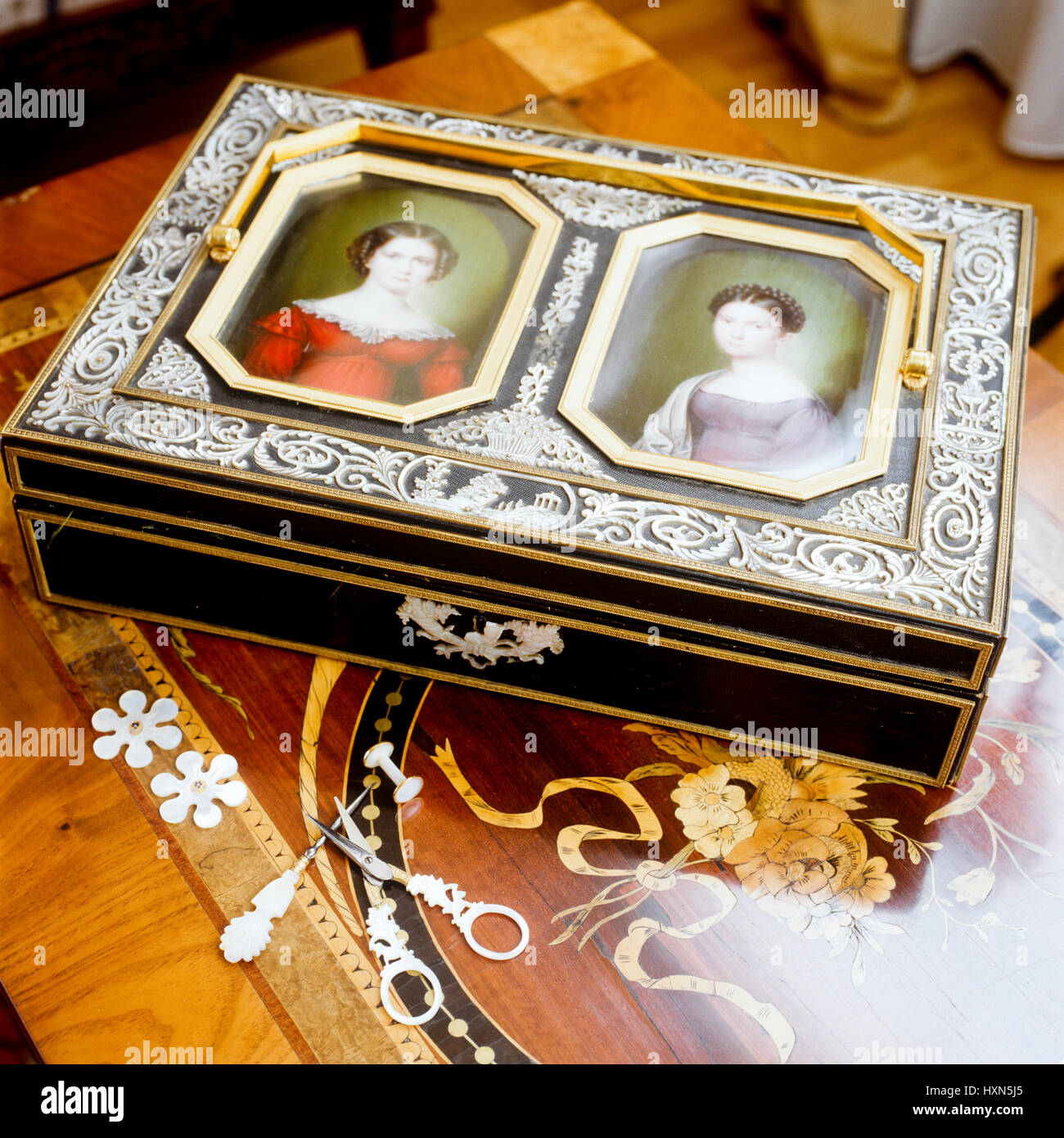 Vintage box with portraits on top Stock Photo - Alamy