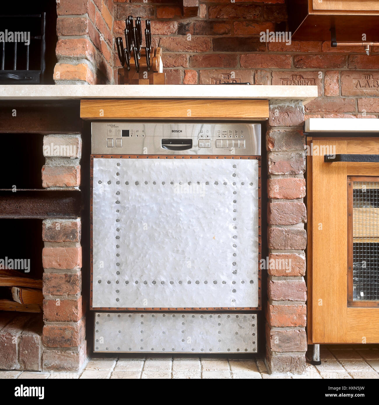 Oven and benchtop in rustic style kitchen Stock Photo - Alamy