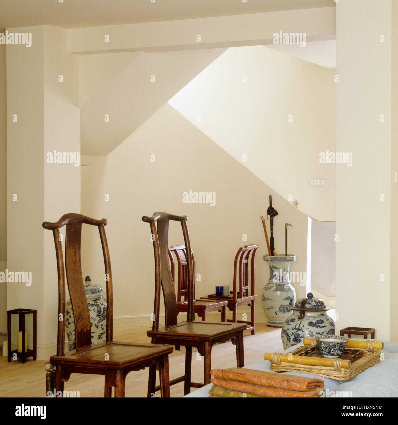 Wooden chairs in oriental style living space Stock Photo - Alamy
