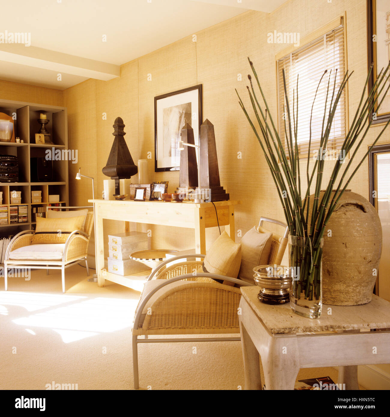 Console table between two armchairs Stock Photo - Alamy