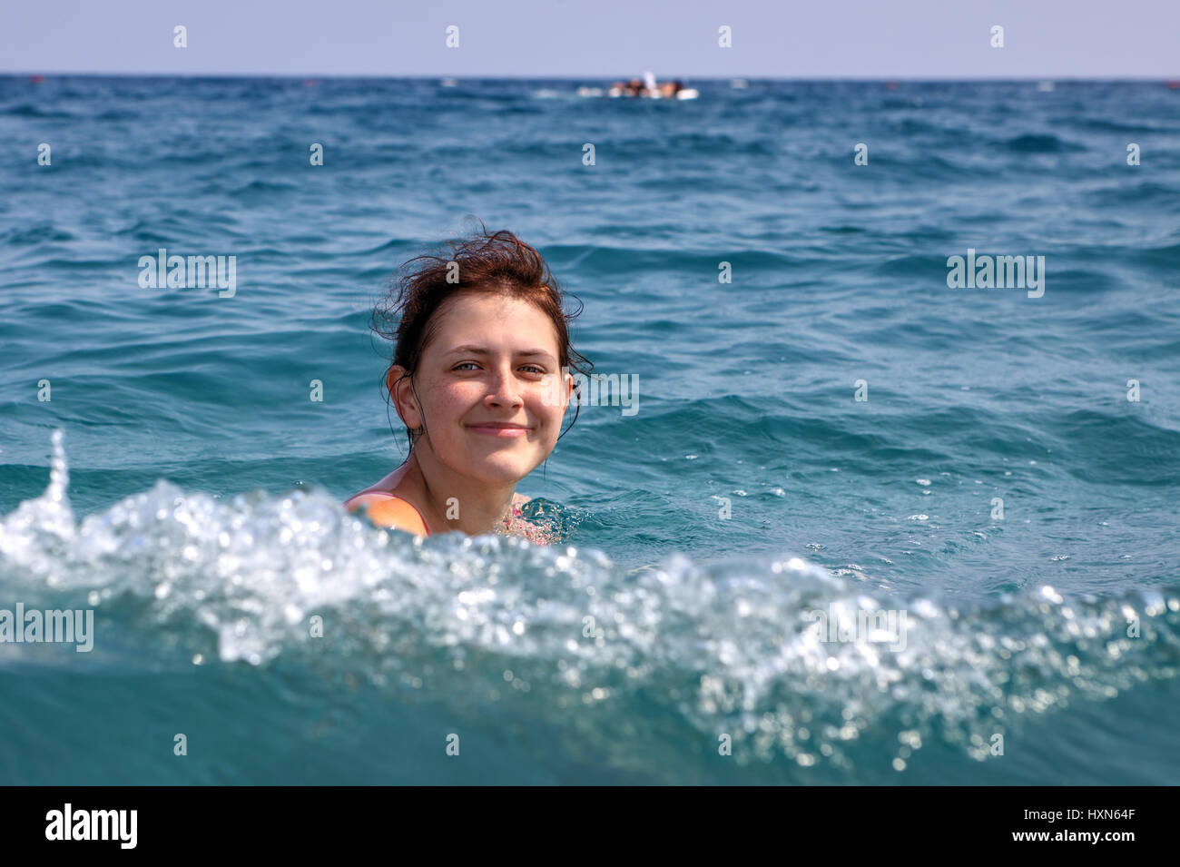 Young woman splashing in sea hi-res stock photography and images - Alamy